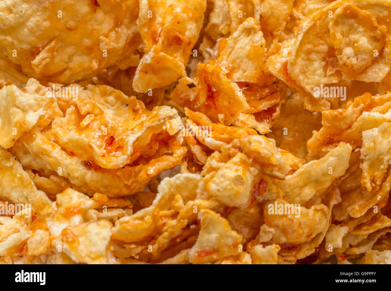 Sweet and spicy indonesian snack emping blado Stock Photo - Alamy