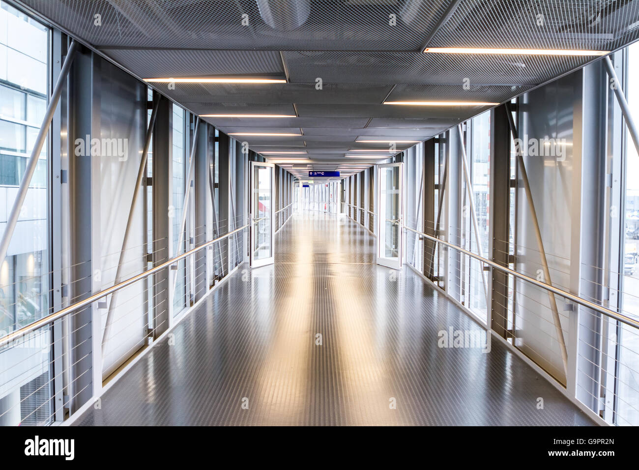 an metal corridor with glass in order to go to the plane Stock Photo ...