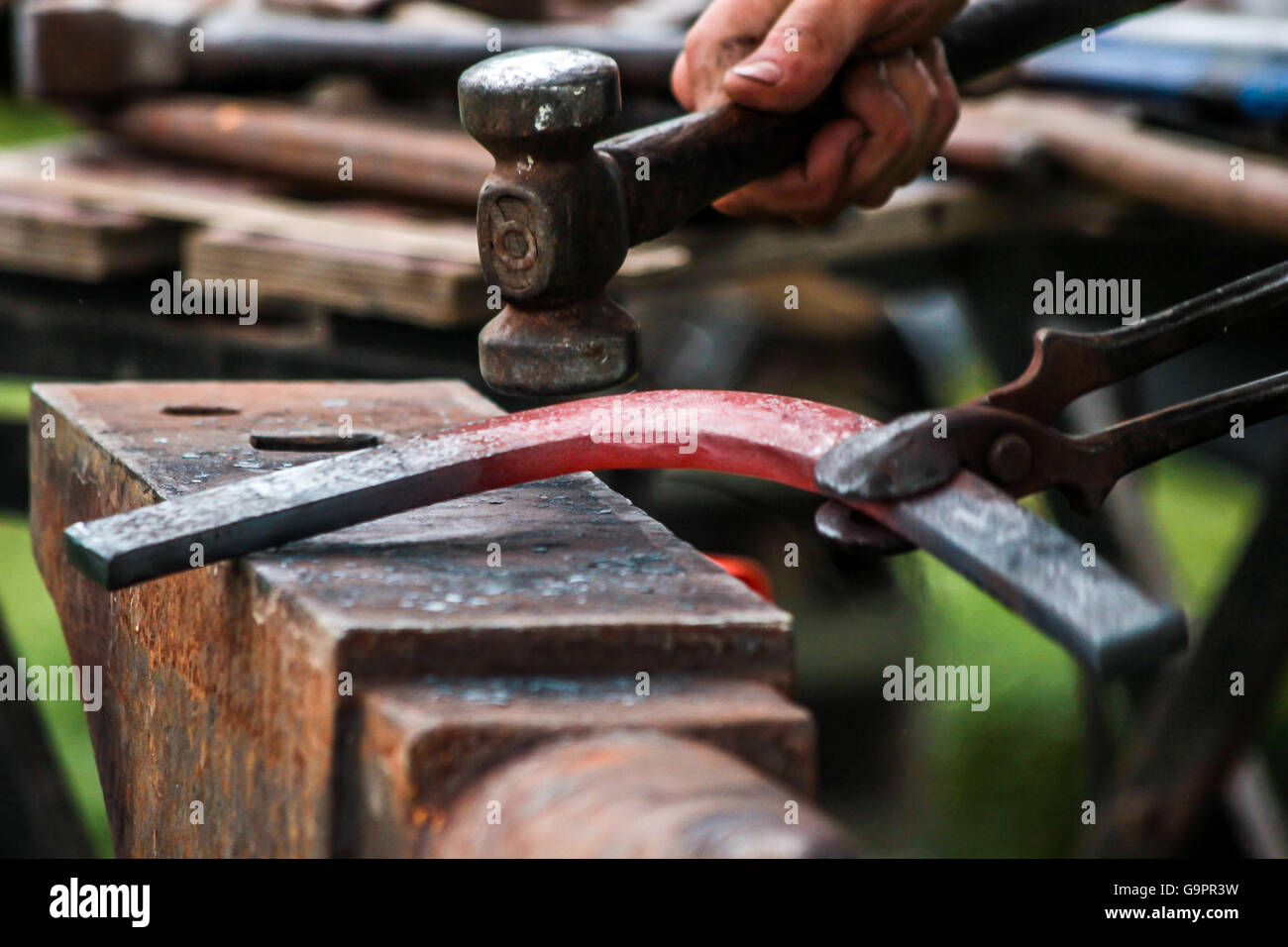 Blacksmith working very hard Stock Photo - Alamy