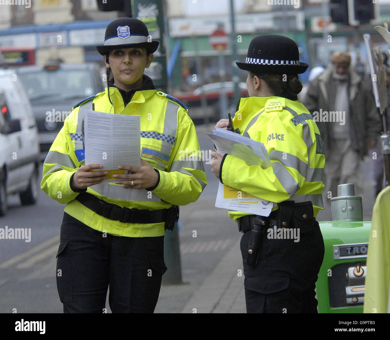 Police officers distribute community information leaflets in Birmingham ...