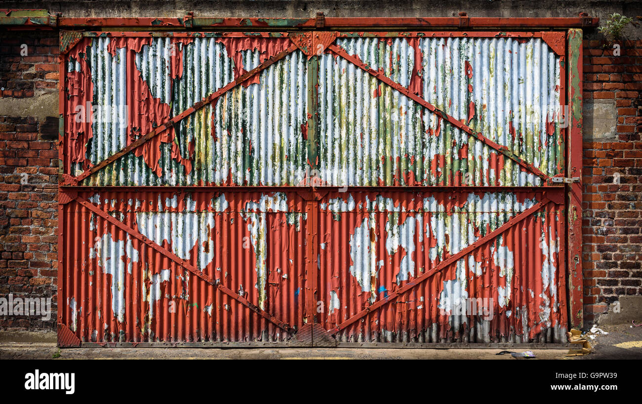 A rusty old sliding industrial door Stock Photo - Alamy