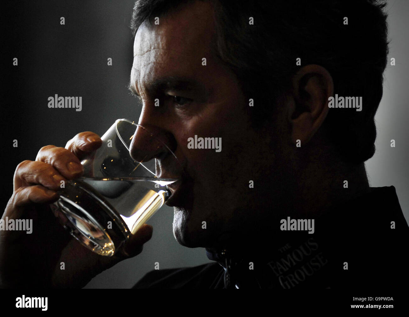 Scotland Coach Frank Hadden takes a sip of water during a press ...