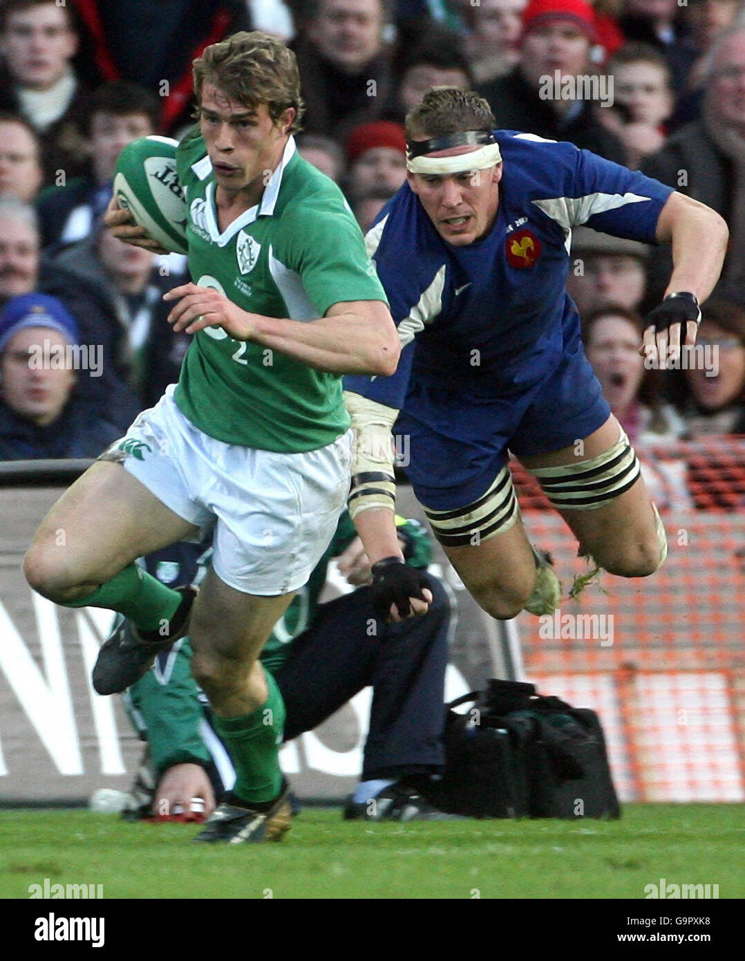 Ireland's Andrew Trimble is chased by France's Sebastien Chabal during ...