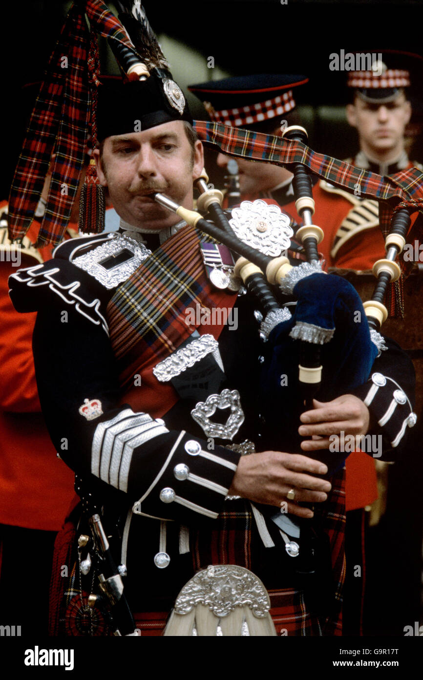 A Piper of the Scots Guards takes up his refrain on the quayside at ...