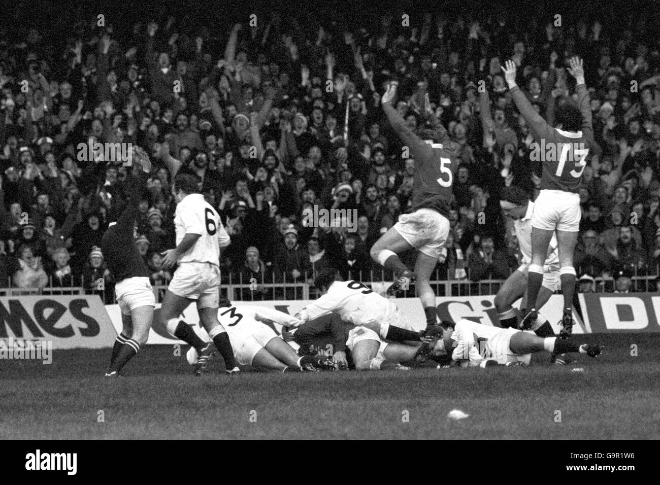 Welsh players celebrate as referee J.B. Anderson (l) signals their ...
