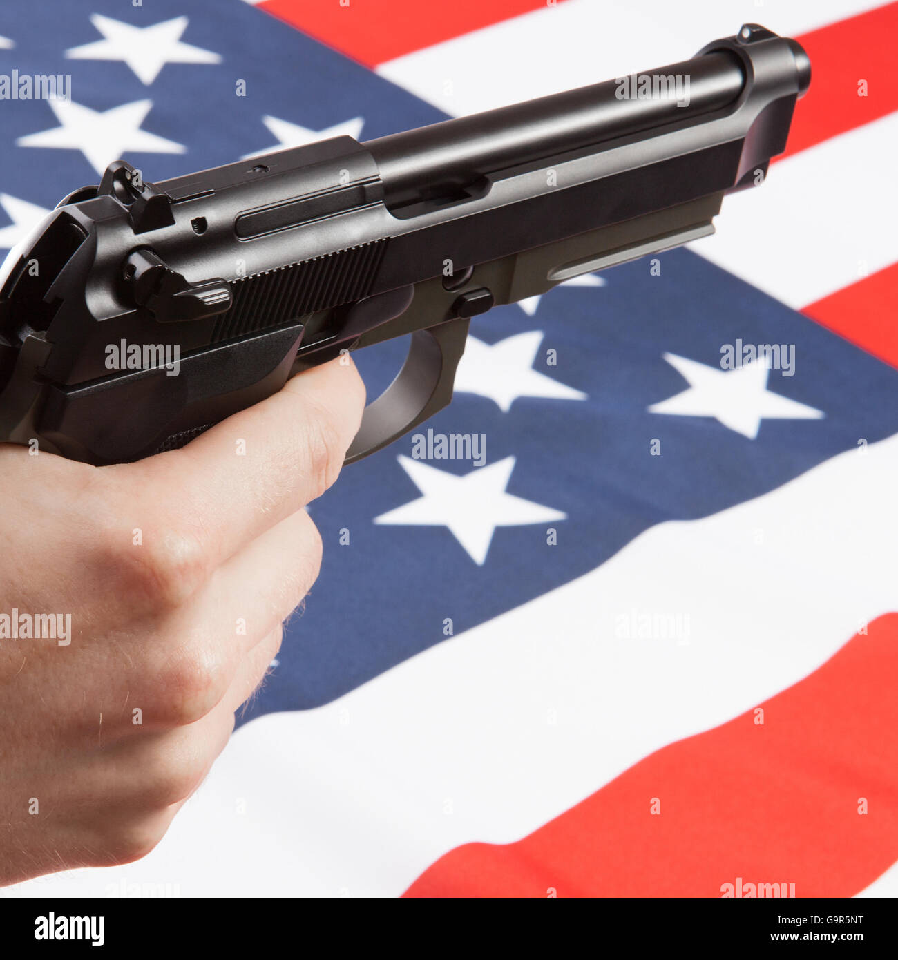 Hand gun us flag hi-res stock photography and images - Alamy