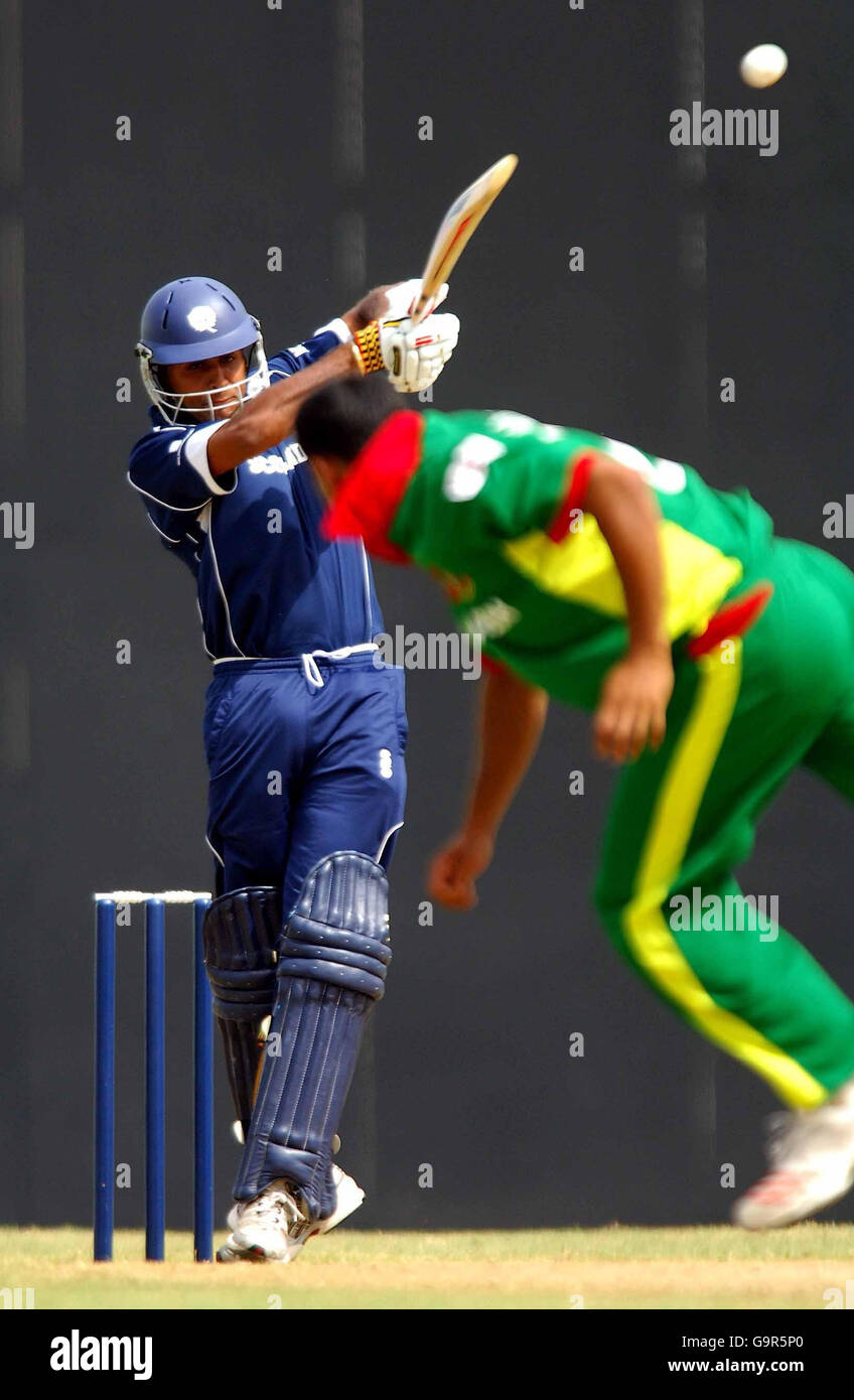 Scotland's Navdeep Poonia hits a four of Bangladesh's Baishya Taposh ...