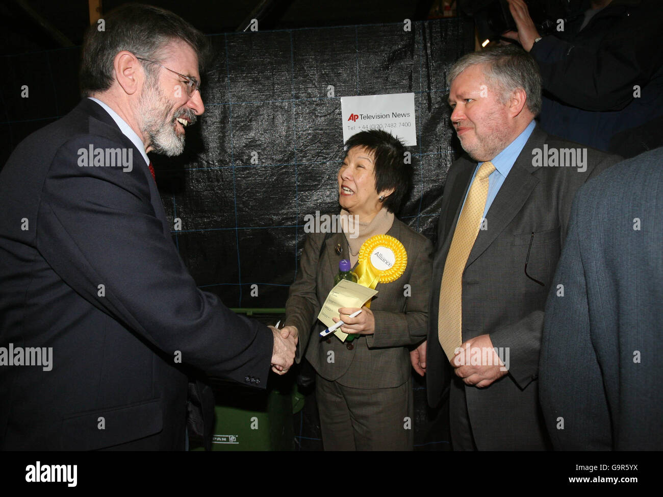 Sinn Fein Leader Gerry Adams shakes hands with Alliance candidate Anna ...