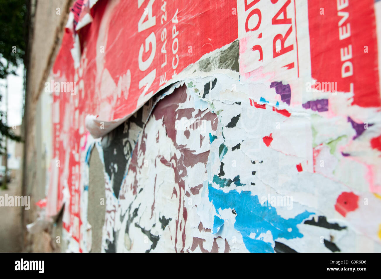 Layers of posters torn down by passers by Stock Photo - Alamy