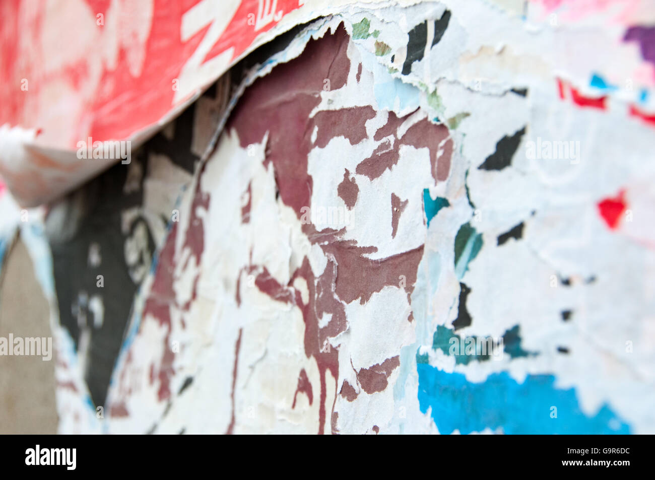 Layers of posters torn down by passers by Stock Photo - Alamy