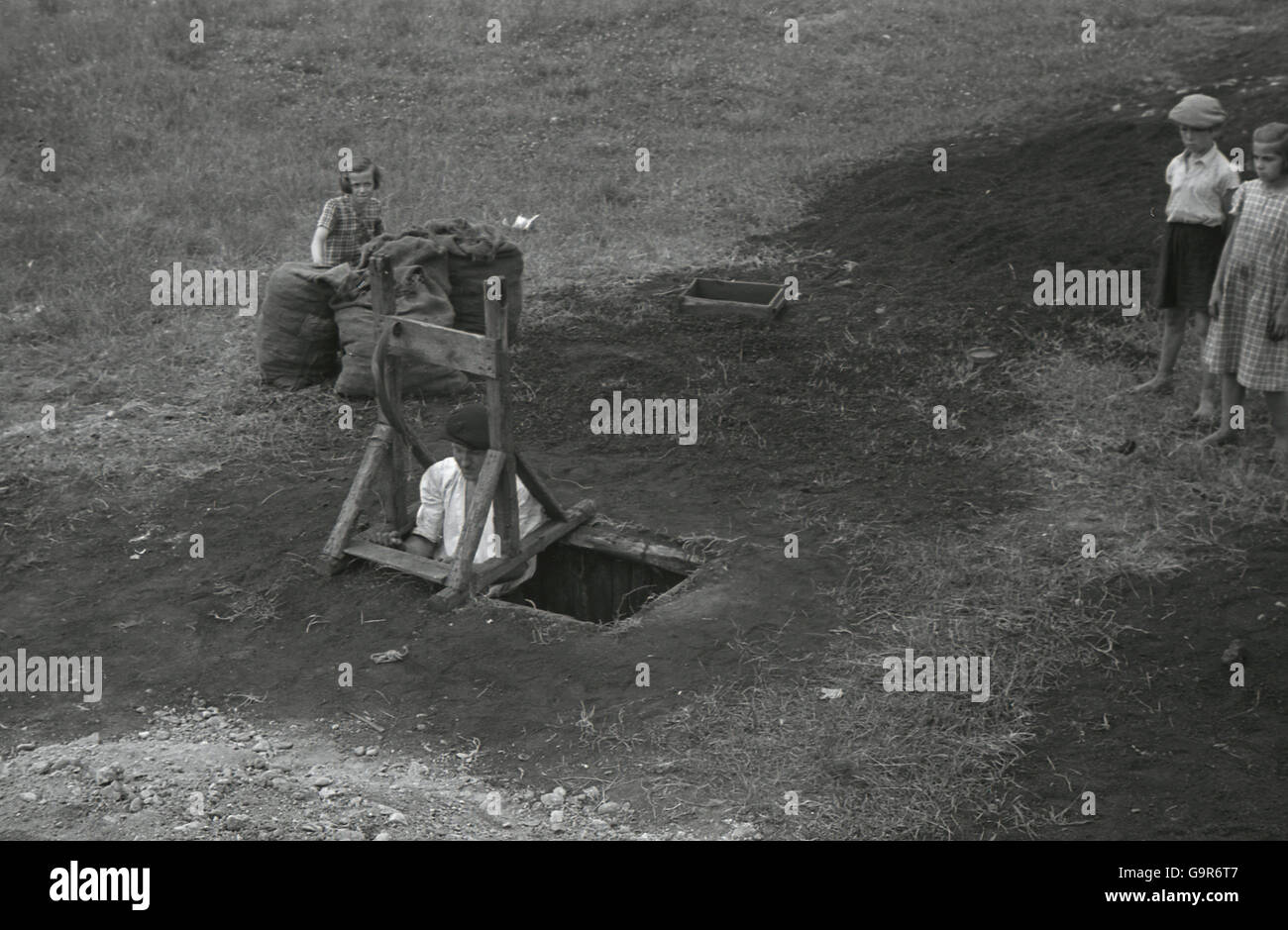 1930s, historical picture showing small scale mining of surface ...