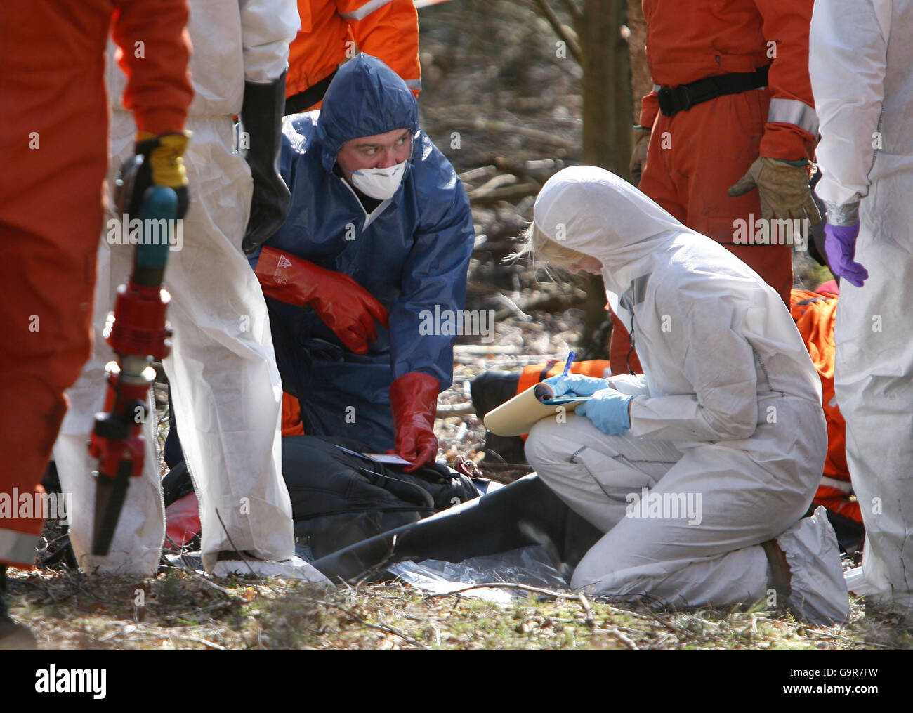 Body recovery officers retrieve a 'body' during a mock-up of an ... Body recovery officers retrieve a 'body' during a mock-up of an ...
