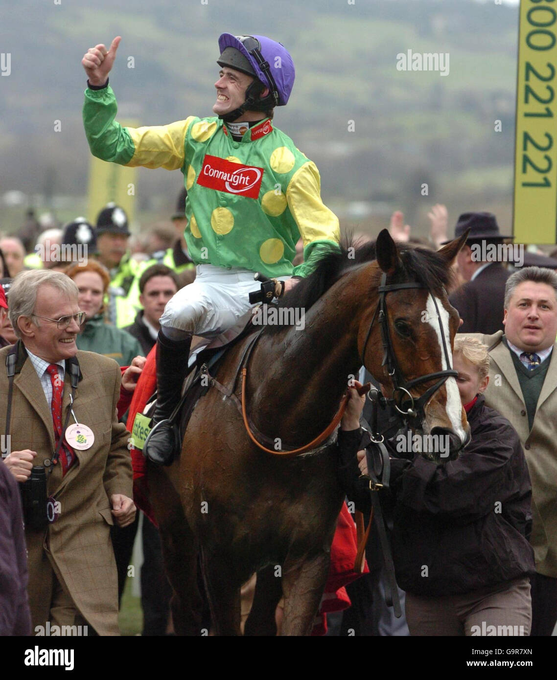 Ruby Walsh gestures to the crowd as he rides Kauto Star into the ...