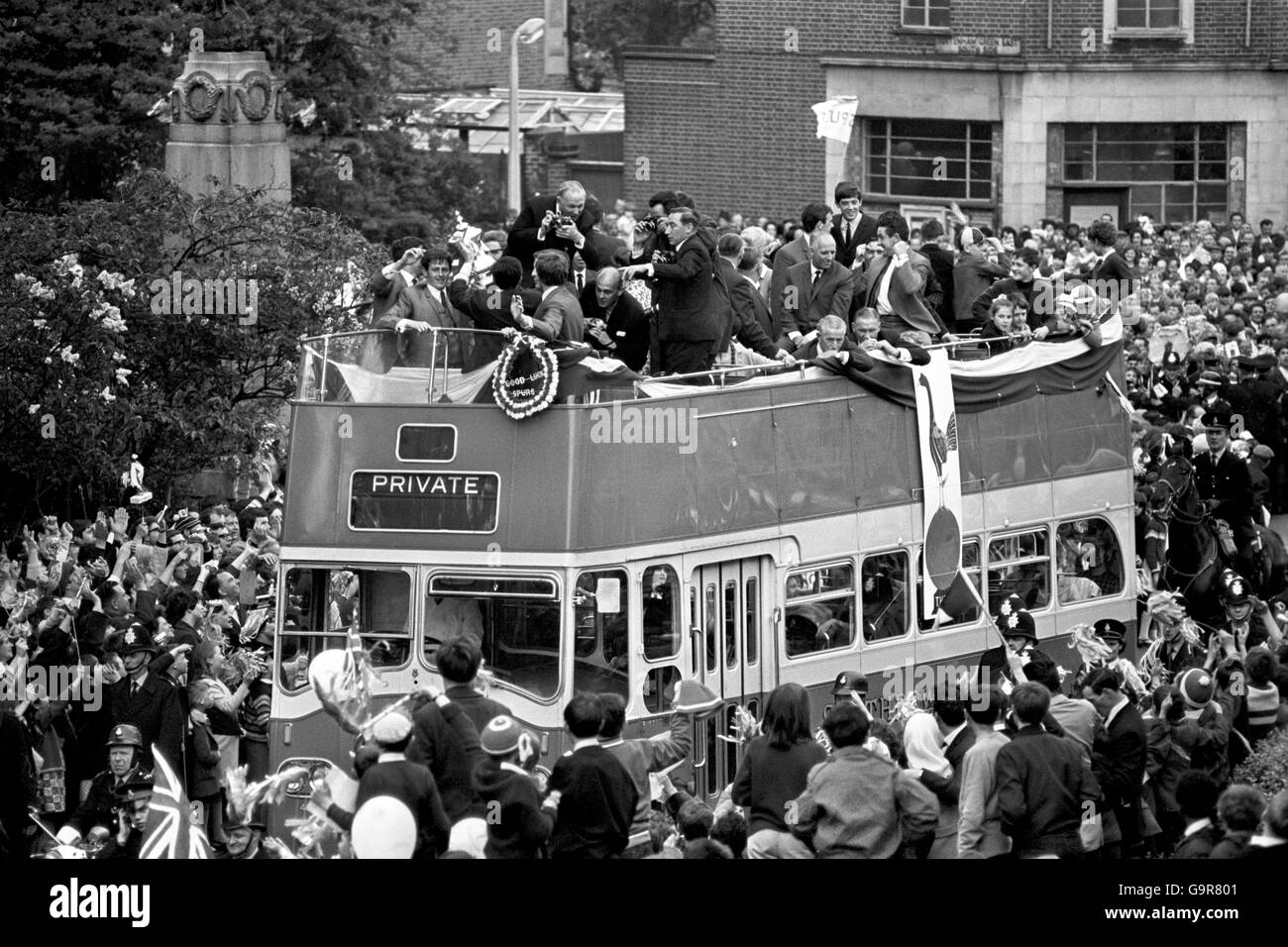 The Tottenham Hotspur team ride atop an open top double decker bus to ...