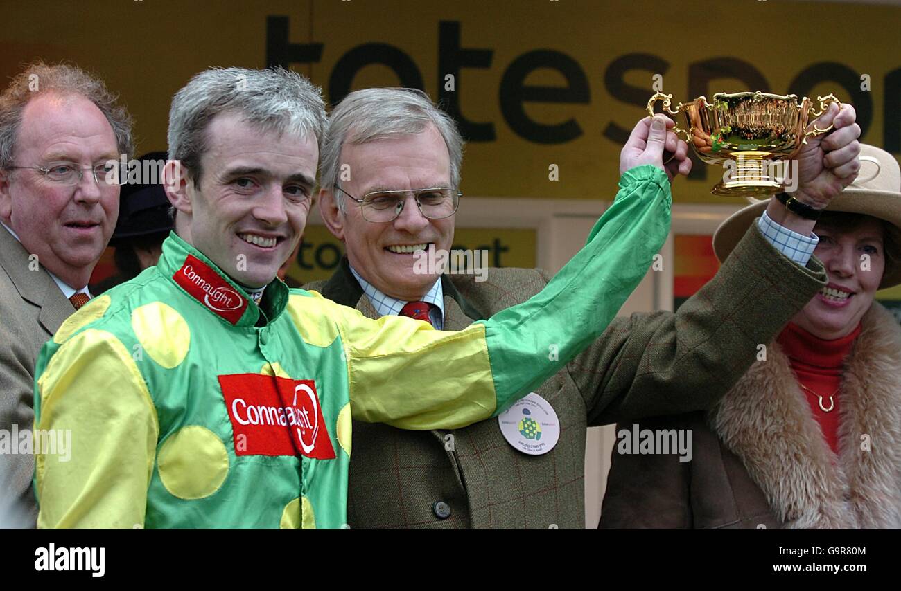 Jockey Ruby Walsh and owner Clive Smith hold the trophy after winning ...