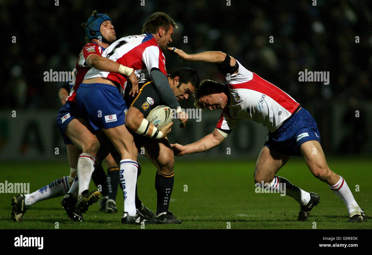 Leeds Rhinos's Kylie Leuluai (centre) is stopped by Wakefield Trinity ...
