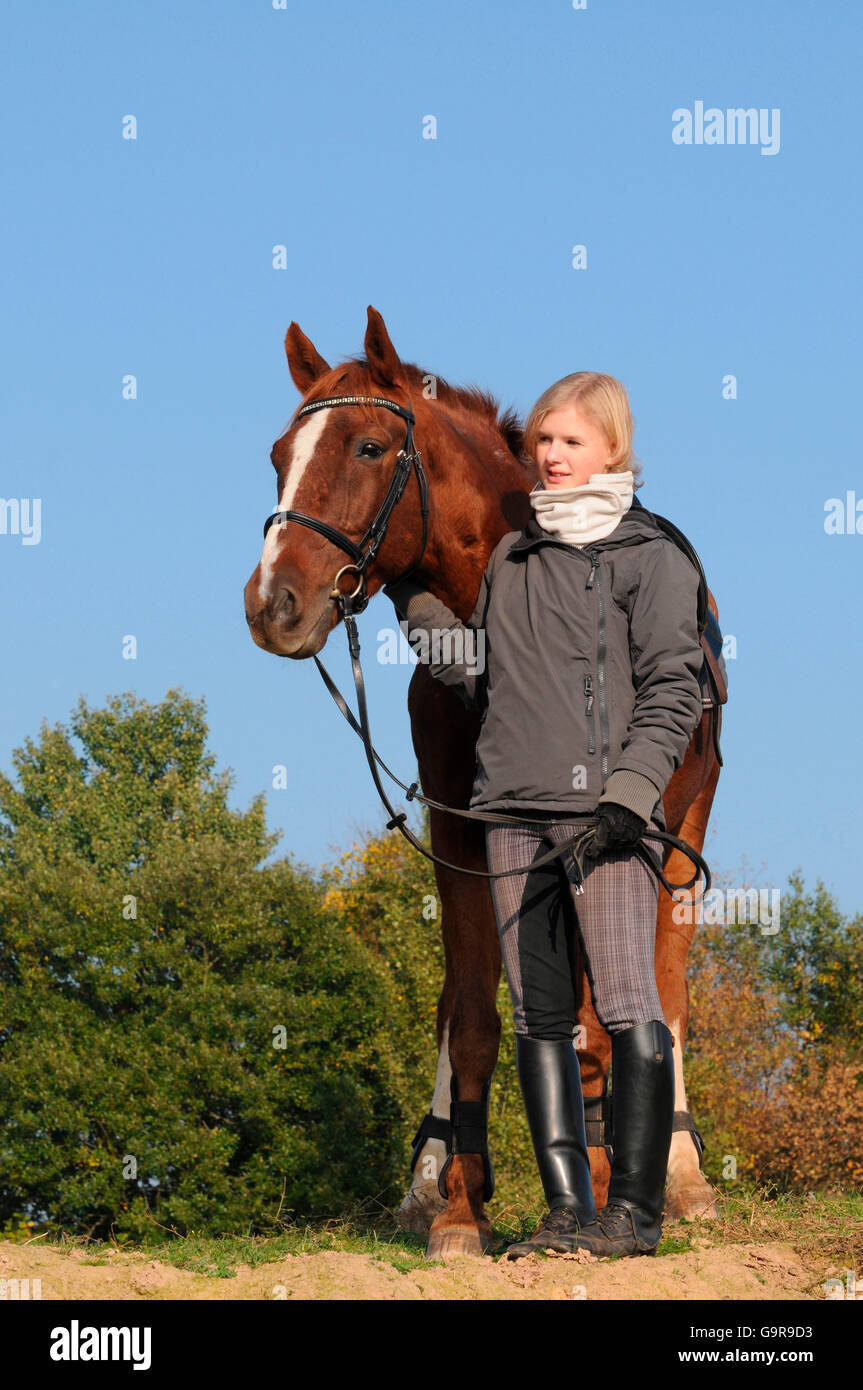 Girl with German Warmblood / sorrell Stock Photo - Alamy