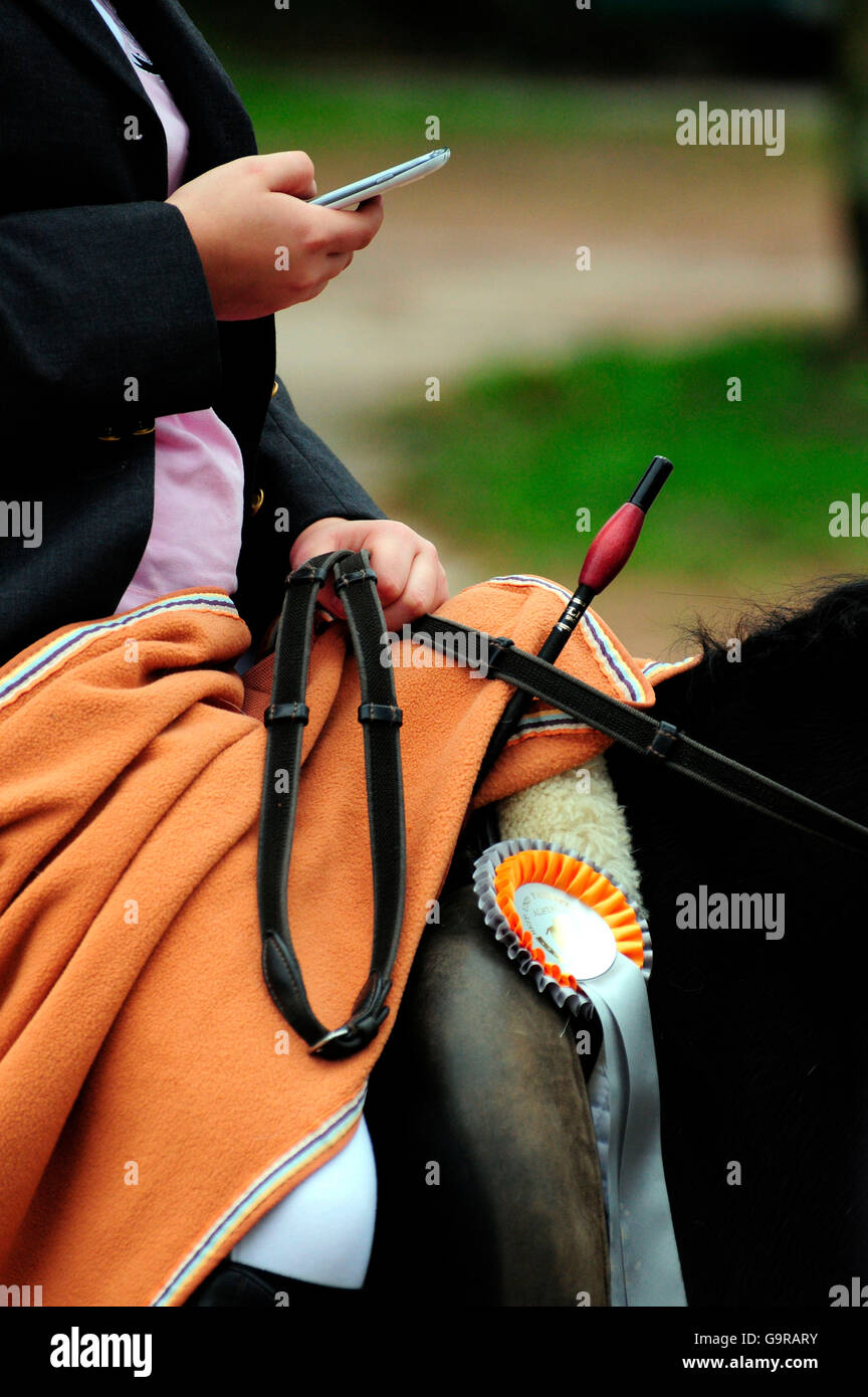 Rider with Mobile Phone, ribbon Stock Photo - Alamy