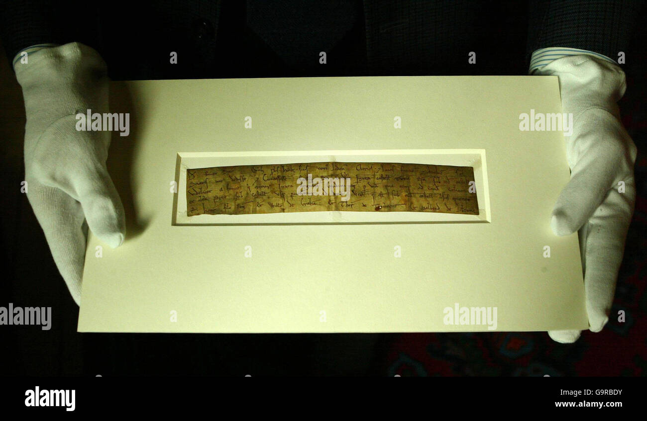 Head of Records David Brown looks at the 1127 King David Charter, as ...