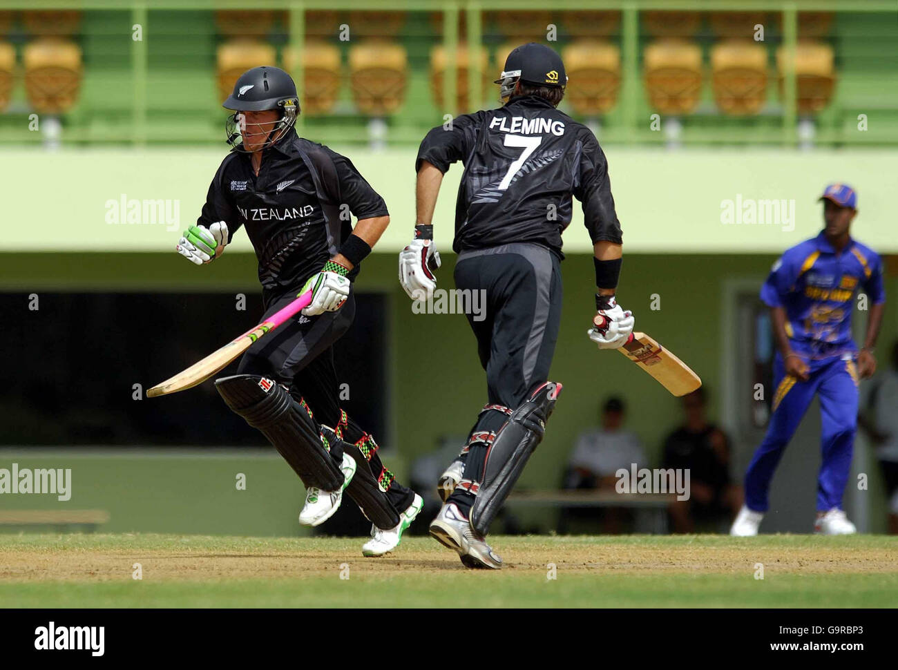 New Zealand's Stephen Fleming (right) and Lou Vincent score runs during ...