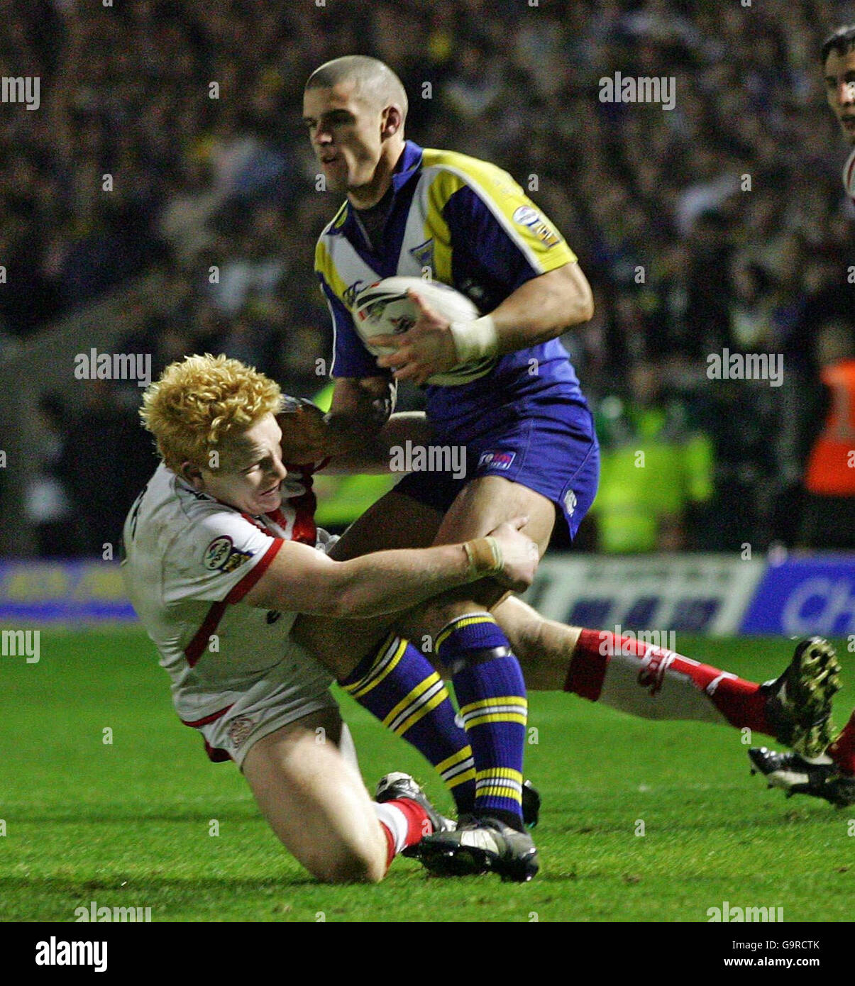 St Helens James Graham halts Warrington's Stuart Reardon during the ...