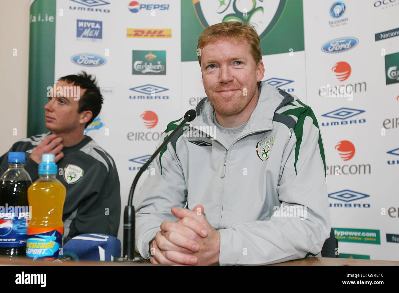 Half length mid top smiling hands together mic mike microphone hi-res ...