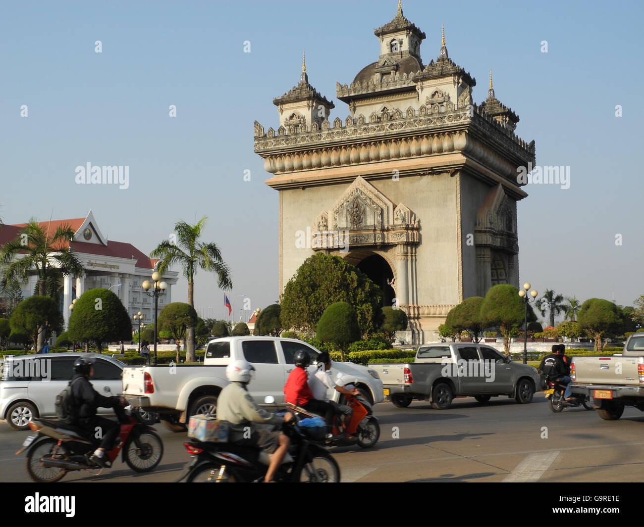 daily traffic at Patuxai gate, Victory Gate of Vientiane, concrete ...
