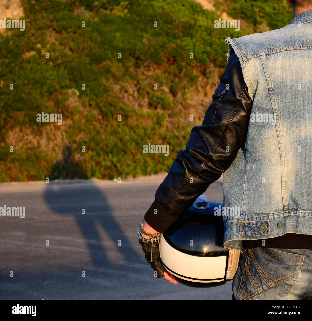 Biker standing at back wheel hi-res stock photography and images - Alamy