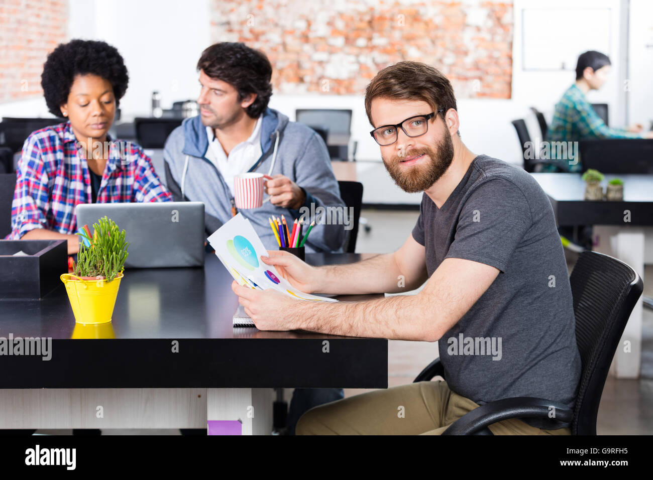 Casual man sitting working office desk, business people Stock Photo - Alamy