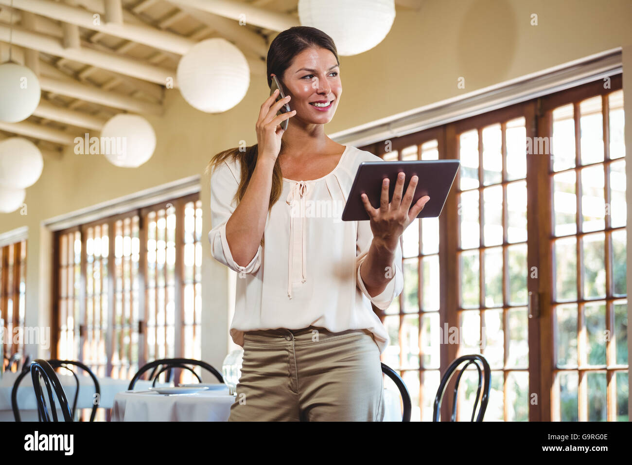 Woman making a phone call Stock Photo - Alamy