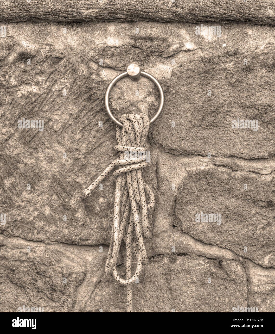close up of a rope tied on a brick wall. Processed for hdr tone mapping ...
