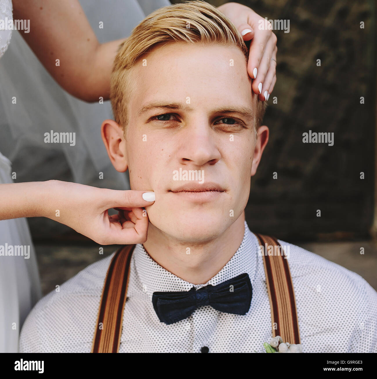 Bride leaning on the groom Stock Photo - Alamy