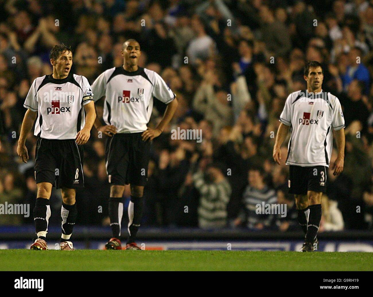 Fulham's Michael Brown, Carlos Bocanegra and Zat Knight stand dejected ...