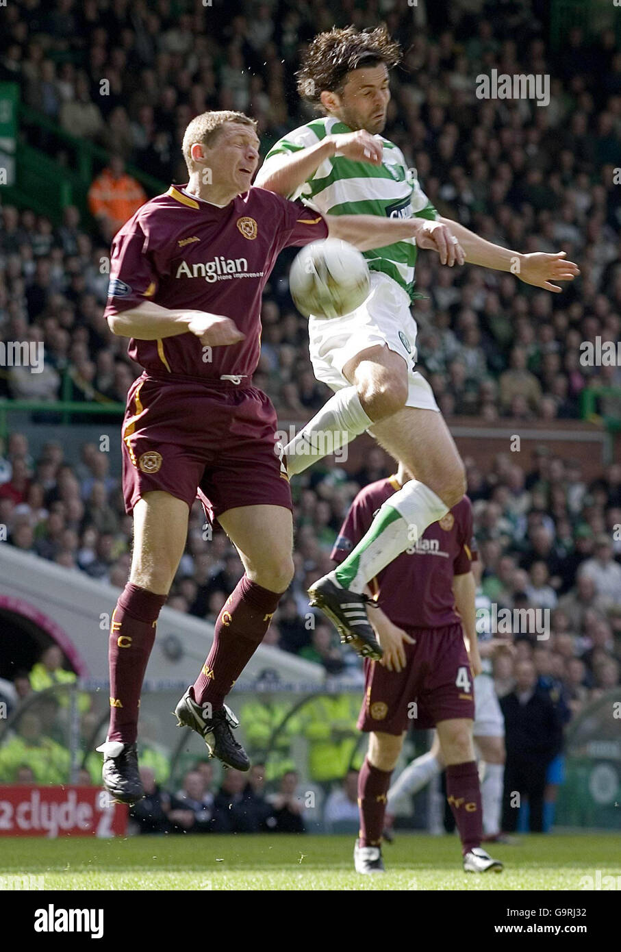 Motherwell's Martyn Corrigan and Celtic's Paul Hartley challenge for a ...