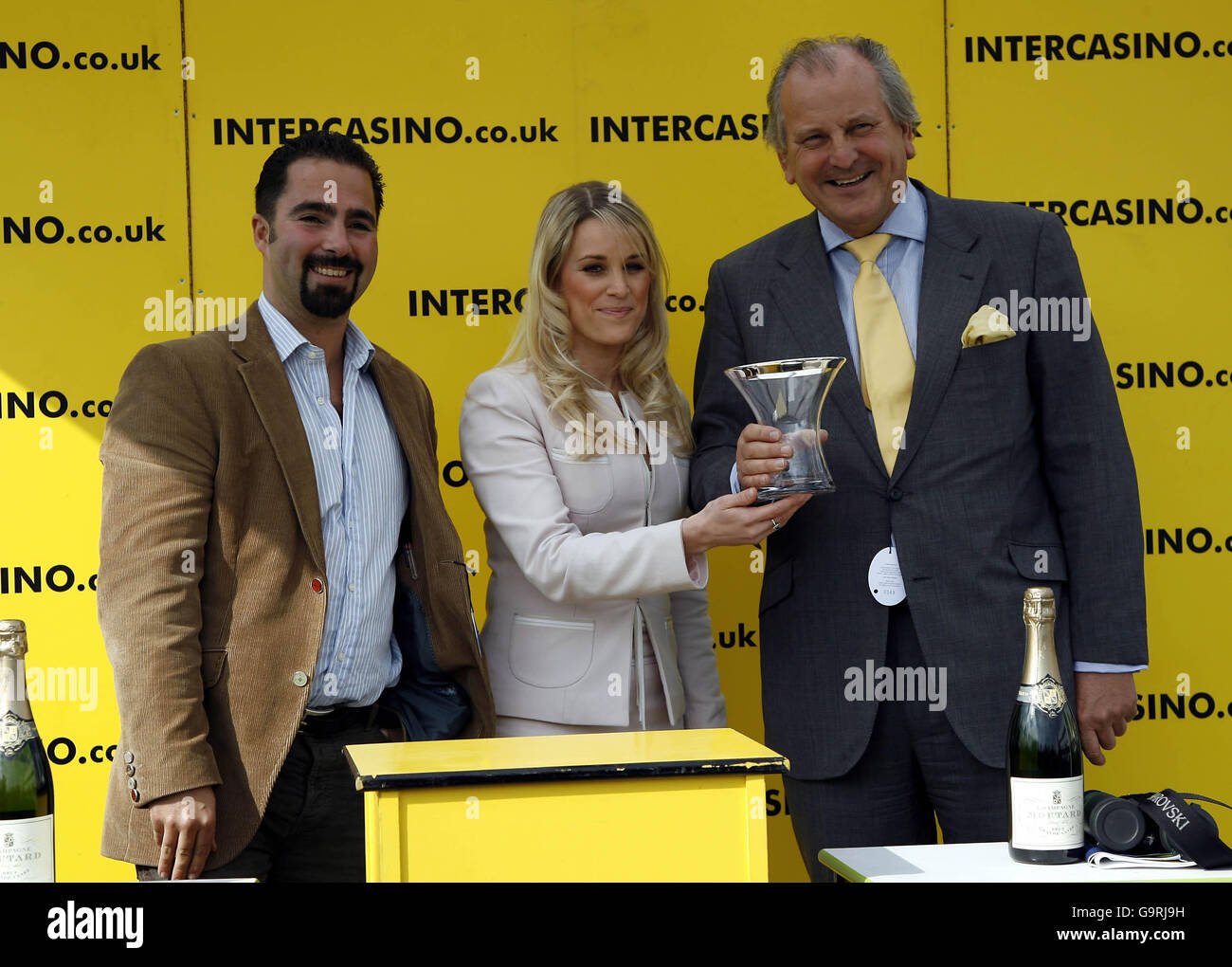 Winning owner of Luberon Brian Yeardley (right) receives the trophy in ...