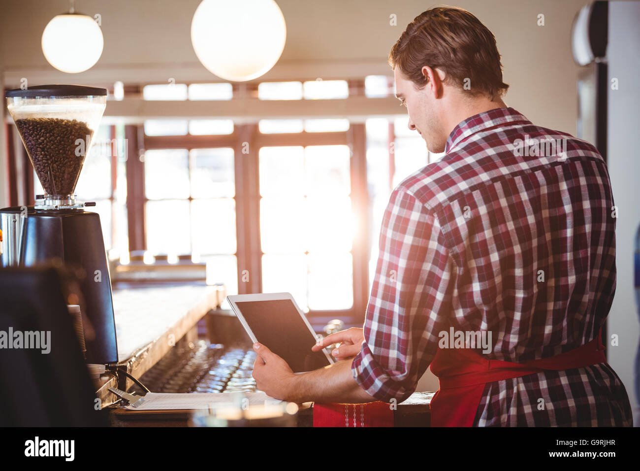 Waiter using digital tablet Stock Photo - Alamy
