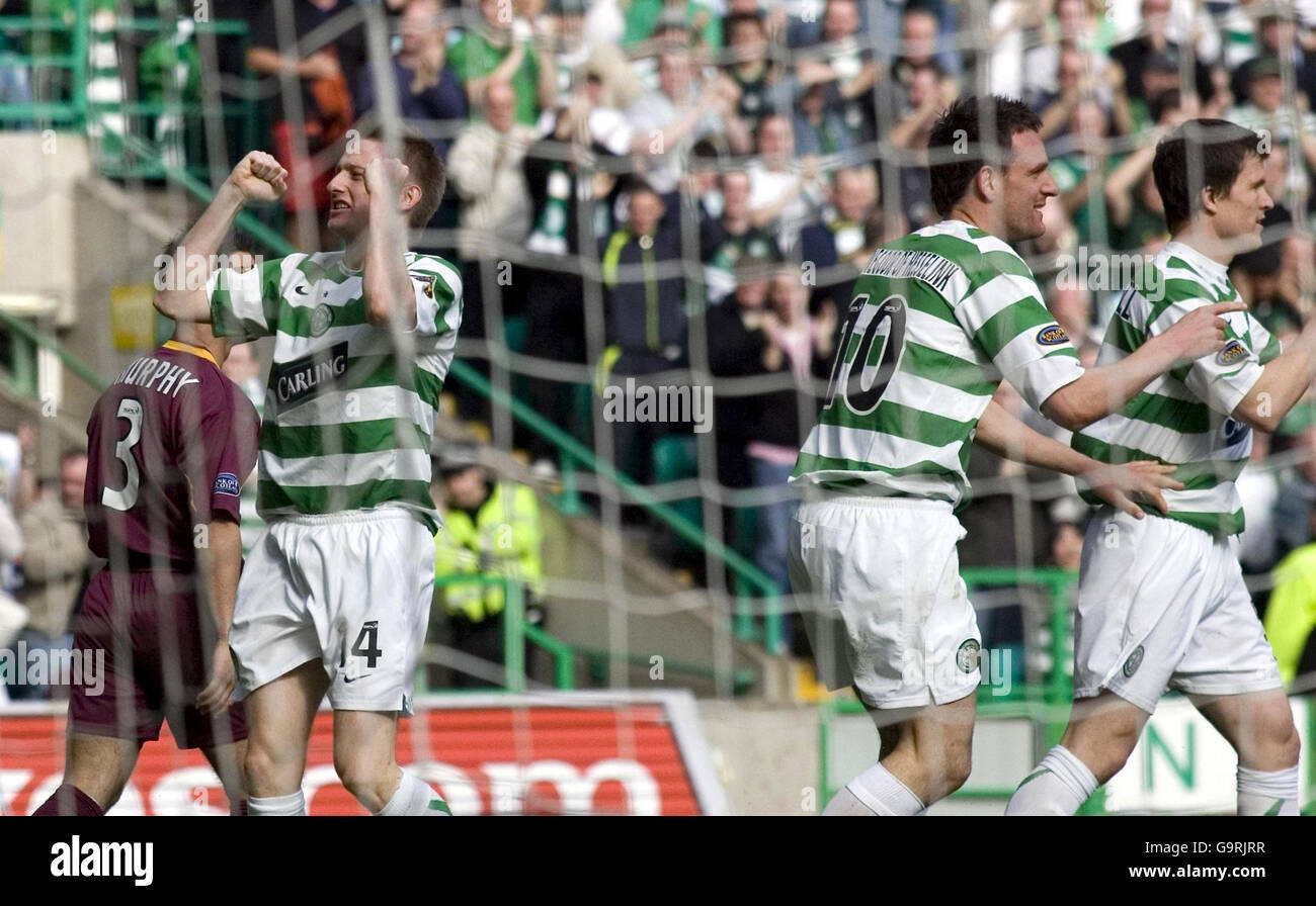 Celtic players celebrate the winning goal scored by Derek Riordan (left ...