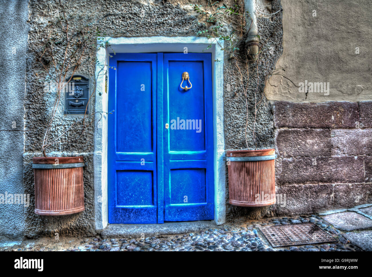blue wooden door in a rustic wall Stock Photo - Alamy