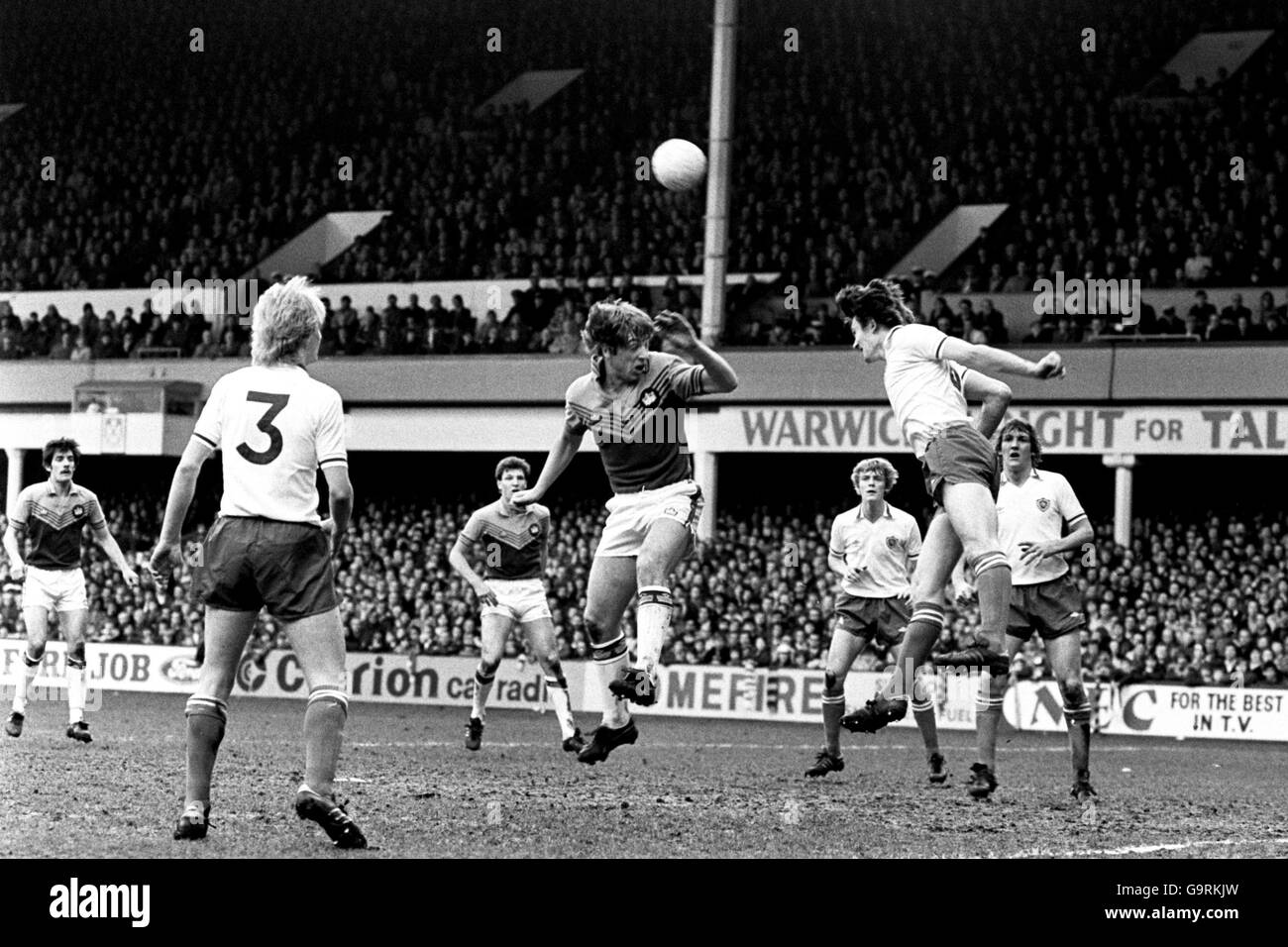 Leicester City's John O'Neill (r) heads clear from West Ham United's ...