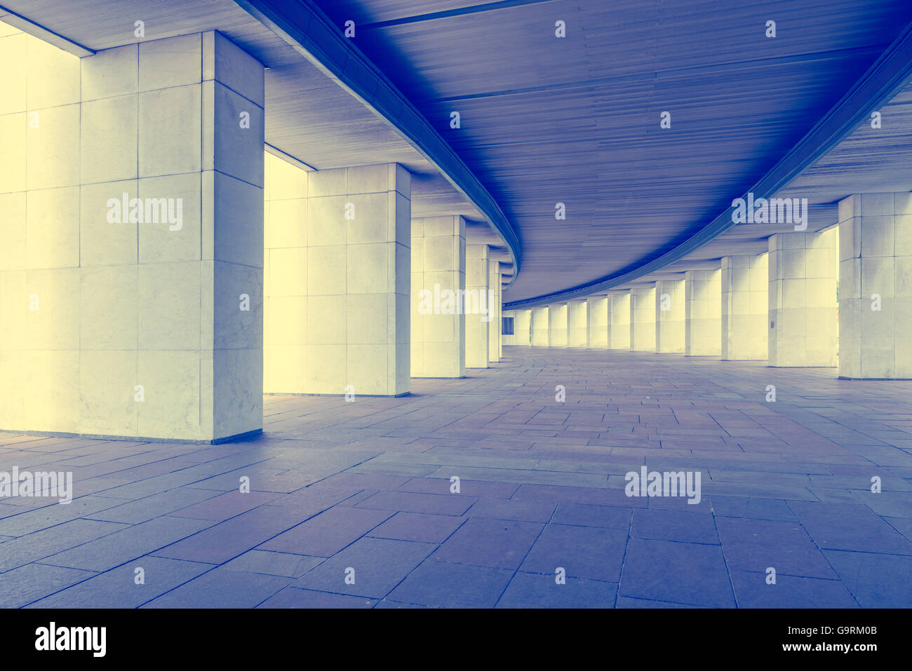 Long wide corridor of the building with columns Stock Photo - Alamy