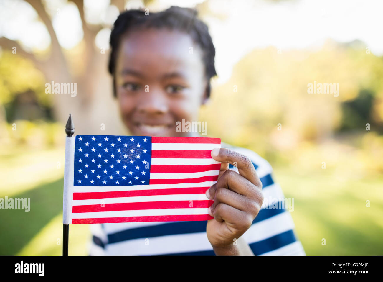 Happy child showing a usa flag Stock Photo - Alamy