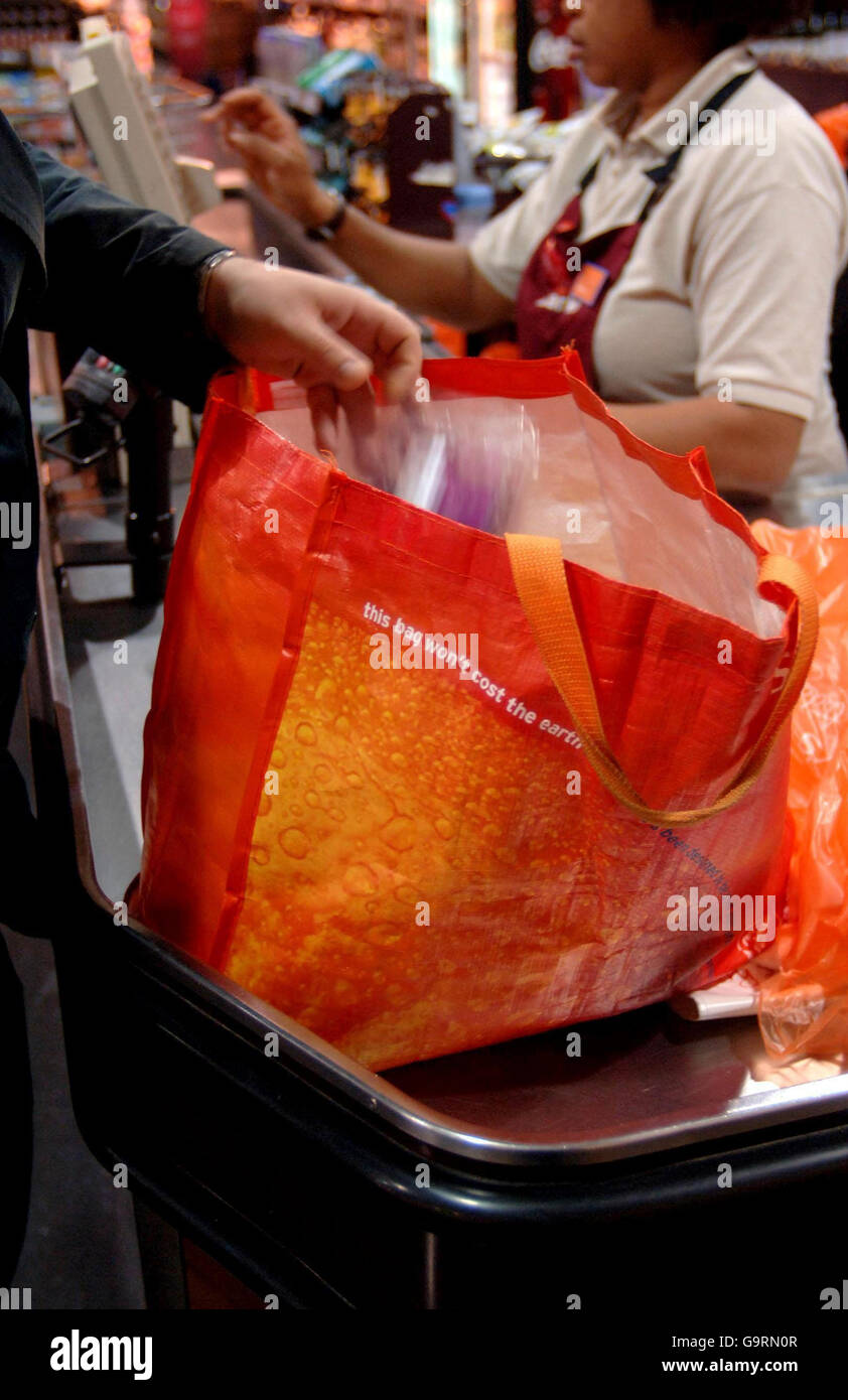 A man packs his shopping into a reusable bag called a 'Bag for Life' in ...