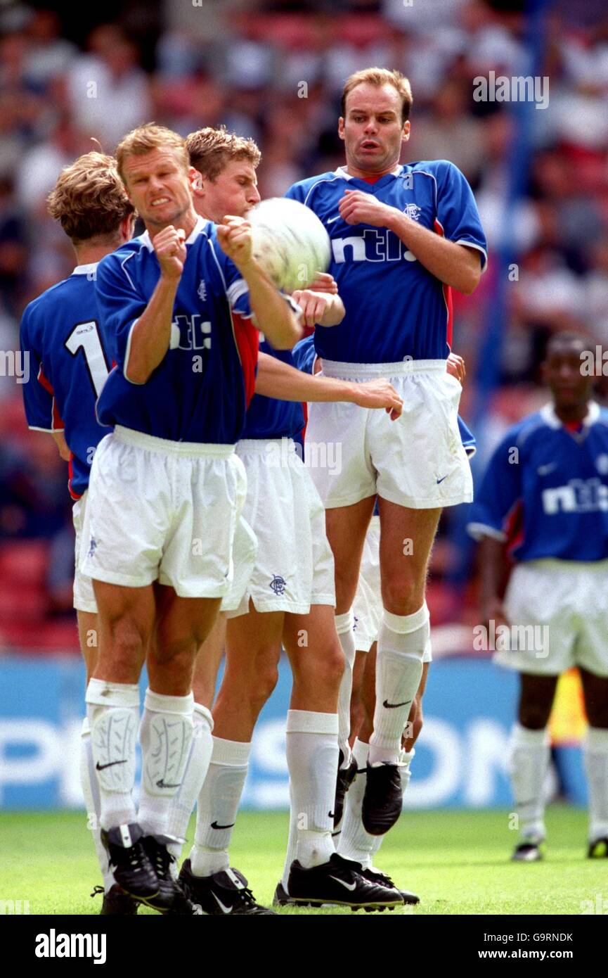(L-R) Rangers' Bert Konterman, Arthur Numan, Tore Andre Flo and ...