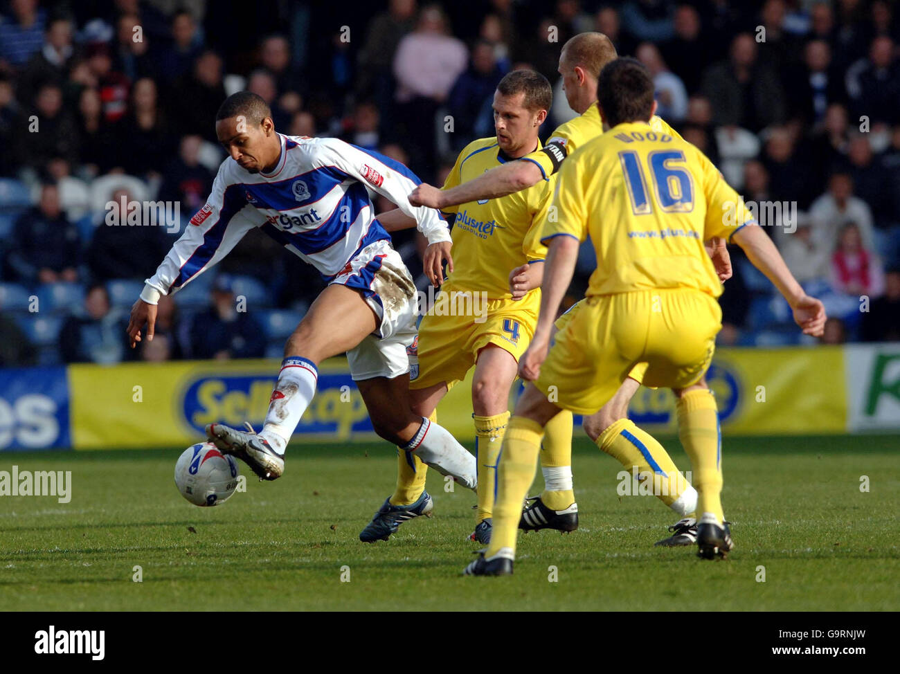 QPR's Dexter Blackstock (left) and Sheffield Wednesday's Kenny Lunt ...