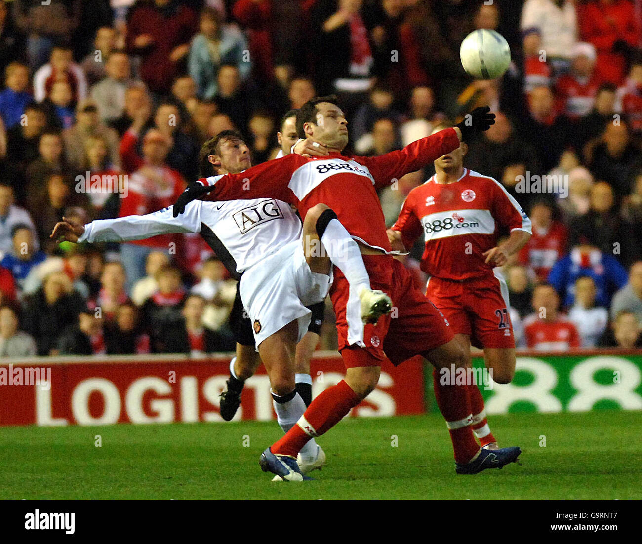 Manchester United's Gabriel Heinze (left) and Mark Viduka of ...