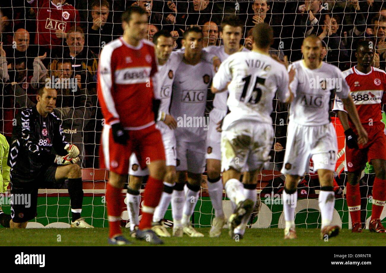 Middlesbrough's Mark Schwarzer (left) sits dejected after failing to ...