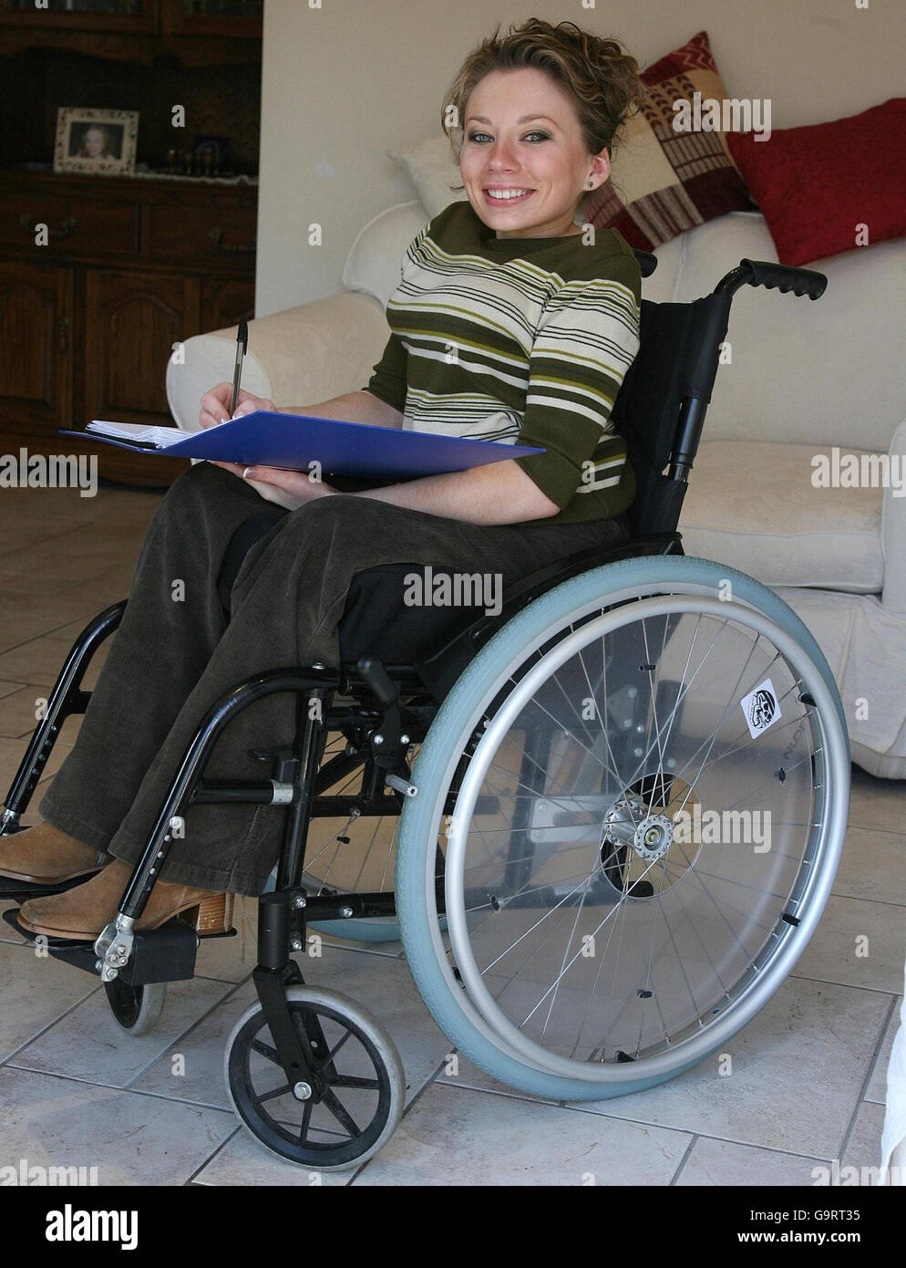 Paraplegic student 'degraded' by carers Stock Photo - Alamy