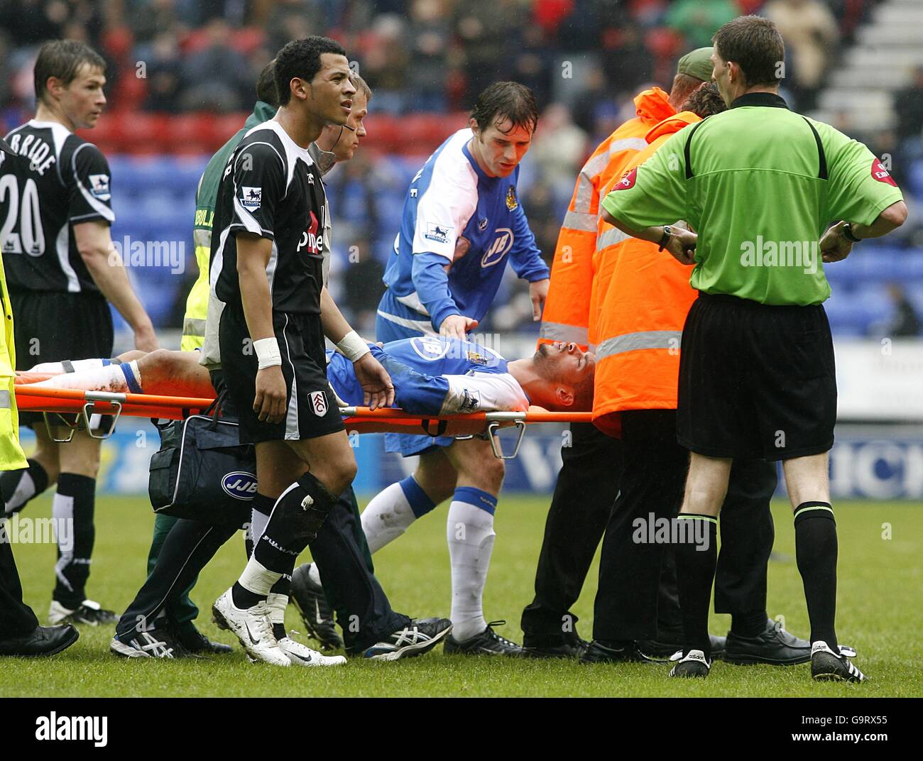 Full length serious injury stretcher football hi-res stock photography ...