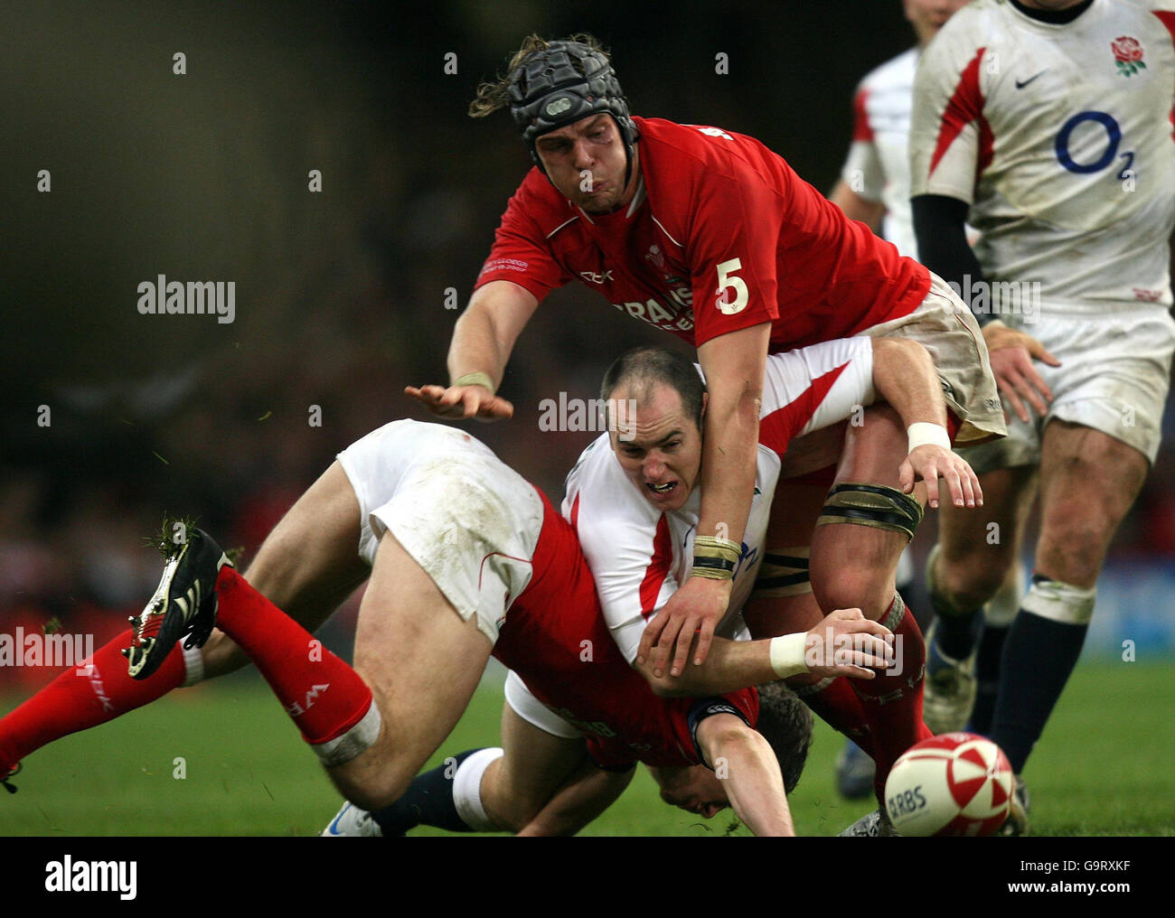 Full length ball action helmet tackling mangsb hi-res stock photography ...