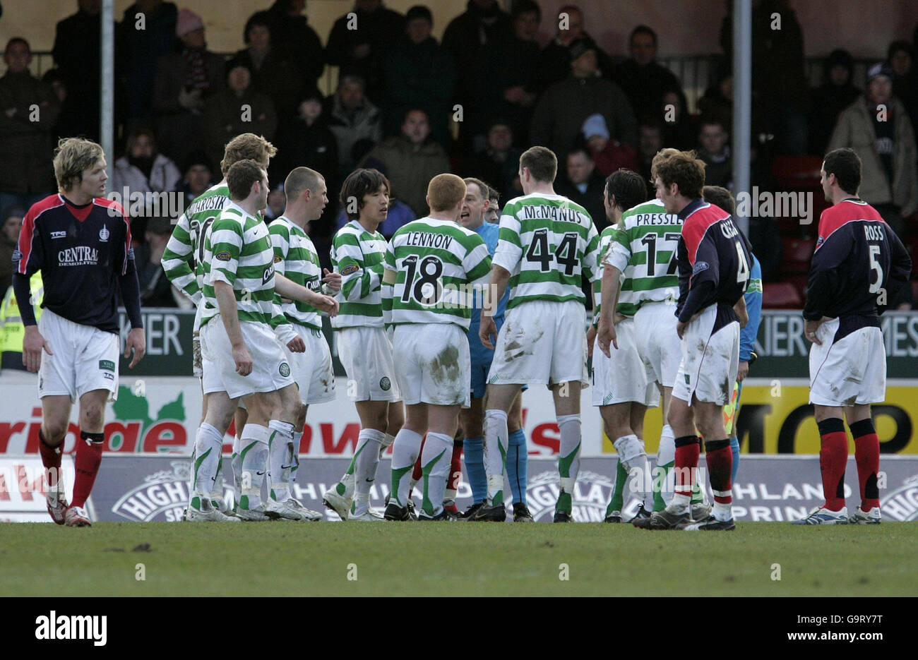 Celtic players crowd around the referee John Underhill as he is about ...